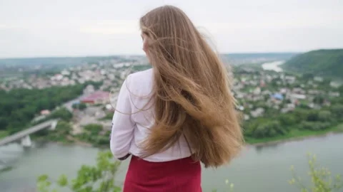 Wind blowing hair of attractive young wo... | Stock Video | Pond5