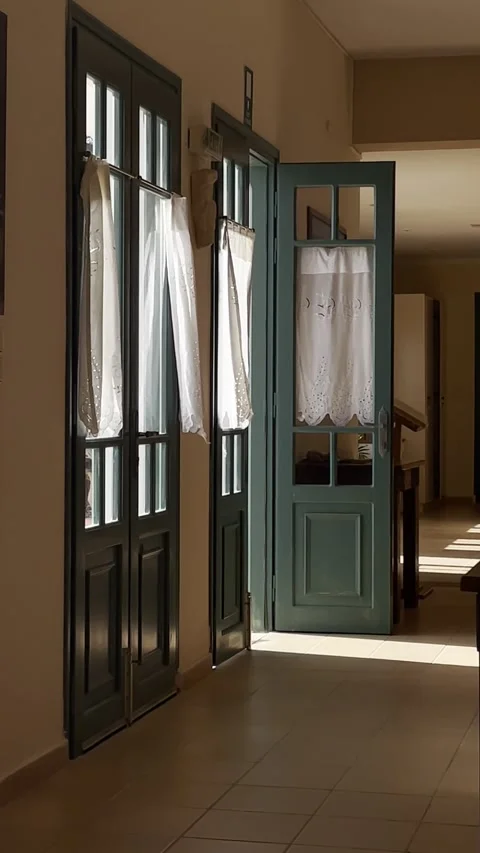 Wind blowing through open door, vertical... | Stock Video | Pond5