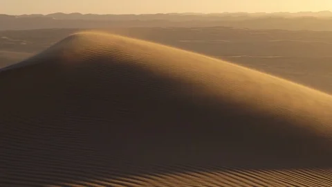 Wind blows swirling sand in dunes in vas... | Stock Video | Pond5