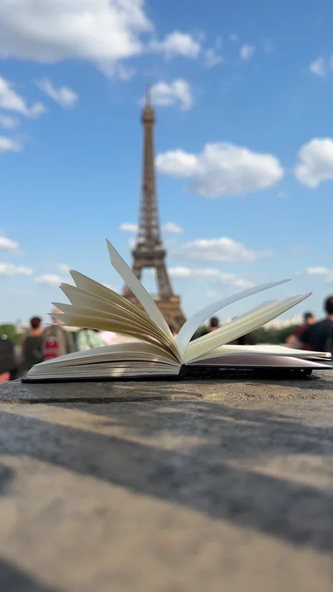 Wind Flipping Notebook Pages Eiffel towe... | Stock Video | Pond5