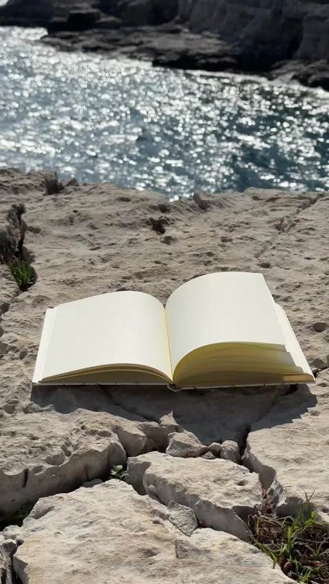 Wind Flipping Notebook Pages on Sea back... | Stock Video | Pond5