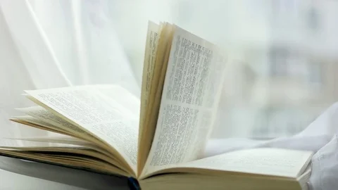 wind flipping pages of holy bible, turni... | Stock Video | Pond5