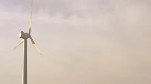 Wind turbine rotate on a sky background ... | Stock Video | Pond5