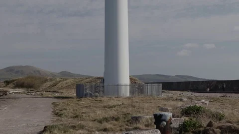 Wind turbine in waste ground next to ind... | Stock Video | Pond5