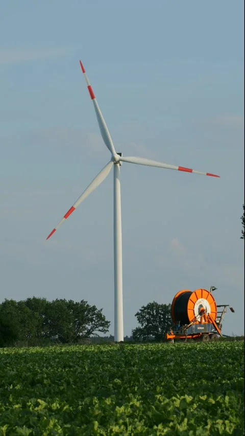 Wind turbines field field irrigation hos... | Stock Video | Pond5