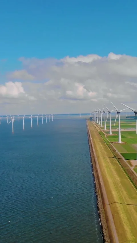 Windmill turbines with a blue sky, windm... | Stock Video | Pond5