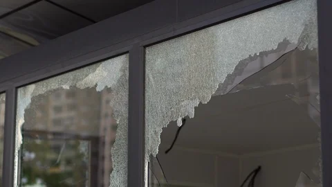 Window frame with broken glass close-up | Stock Video | Pond5
