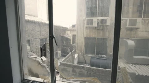 Window view at collapsed, ruined buildin... | Stock Video | Pond5