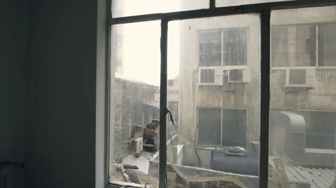 Window view at collapsed, ruined buildin... | Stock Video | Pond5