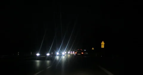 Windshield view of car driving at night ... | Stock Video | Pond5