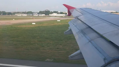 wing view from inside plane cabin while ... | Stock Video | Pond5