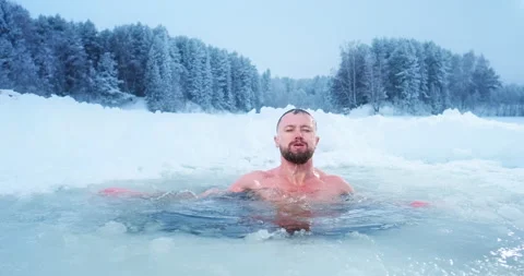 Winter swim, cold treatment. Young man s... | Stock Video | Pond5
