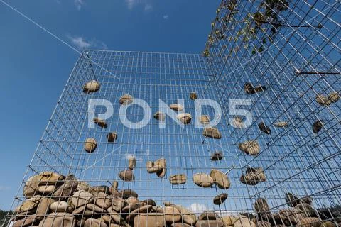 Wire Gabion Rock Fence. Stone wall texture, rocks behind metal grid ...