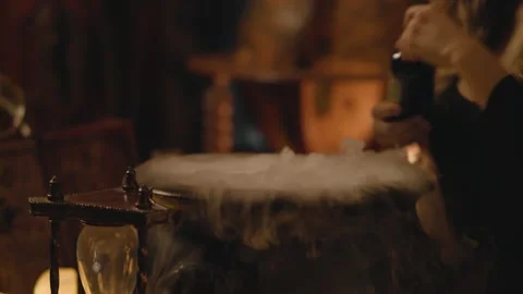 Witch Creating Magic Potions in a Cauldr... | Stock Video | Pond5