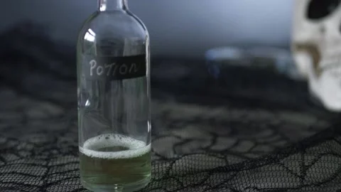 Witches potion with human skull in backg... | Stock Video | Pond5