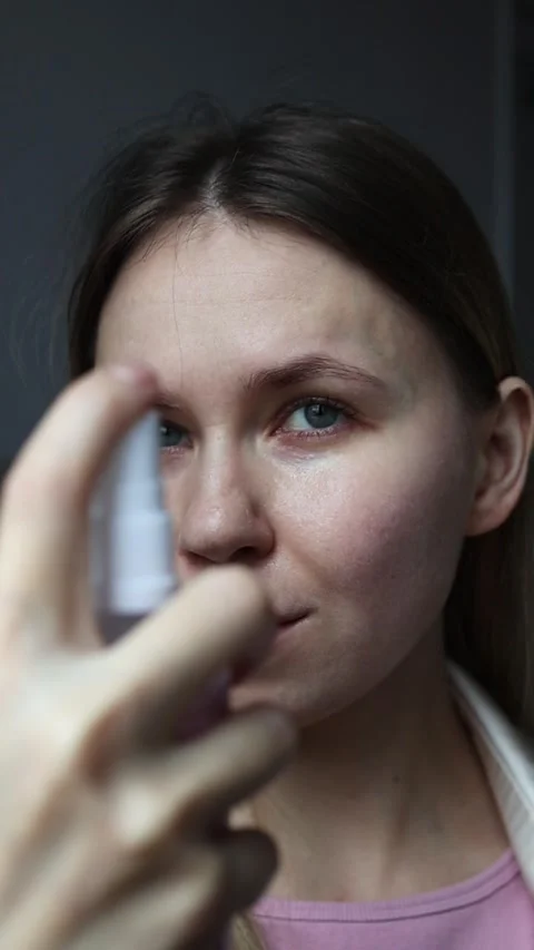 woman applies a facial spray, refreshing... | Stock Video | Pond5