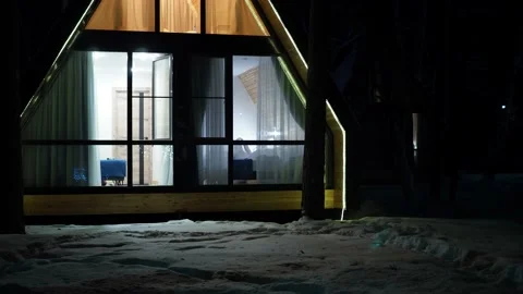 A woman approaches a house with lighted ... | Stock Video | Pond5