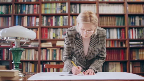 Woman architect making a plan of a build... | Stock Video | Pond5