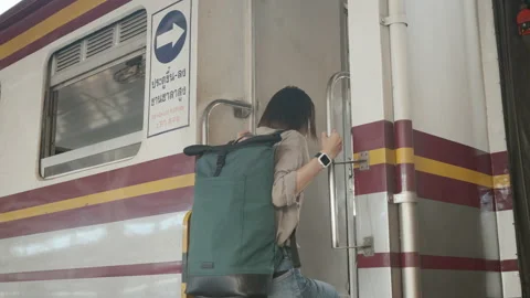 Woman backpacker grabbing the train rail... | Stock Video | Pond5