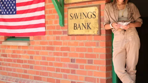 a woman banker in Texas stands at the ba... | Stock Video | Pond5