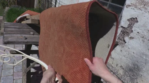 Carpet Beating Stock Footage ~ Royalty Free Stock Videos | Pond5