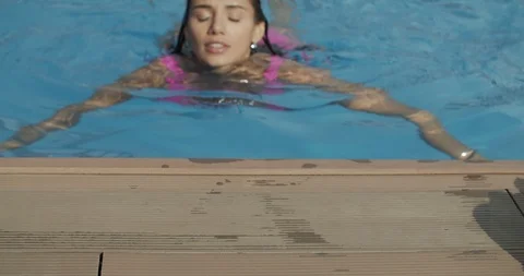 Woman Emerging From Pool Stock Video Footage | Royalty Free Woman ...