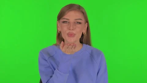 Woman Blowing Flying Kiss on Green Backg... | Stock Video | Pond5