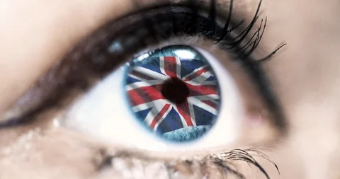 woman blue eye in close up with the flag... | Stock Video | Pond5