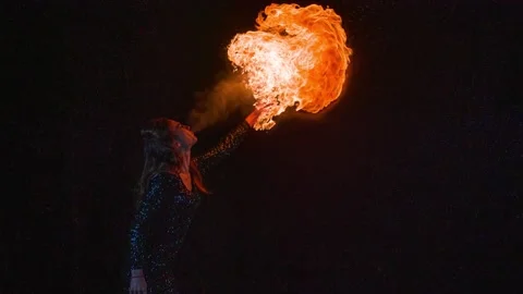 Woman breathing fire in slow motion | Stock Video | Pond5