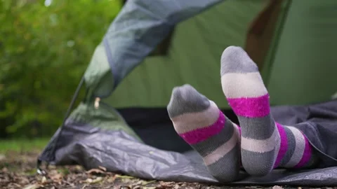 A woman in bright multi-colored socks li... | Stock Video | Pond5