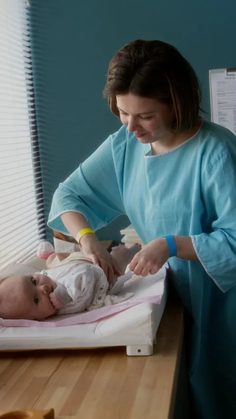 Woman Changing Babys Diaper | Stock Video | Pond5