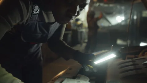 Woman Checking Parts Under Motor Hood | Stock Video | Pond5