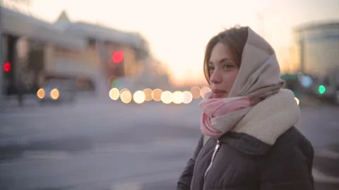 woman in the city in winter is waiting f... | Stock Video | Pond5