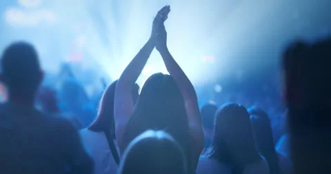 Woman clapping hands at concert, back vi... | Stock Video | Pond5