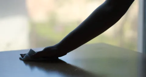 Woman cleaning table surface with wet wi... | Stock Video | Pond5