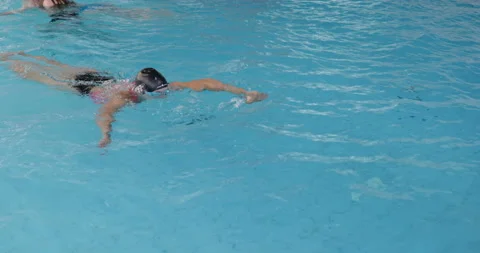 Woman concentrated swimming forward, wea... | Stock Video | Pond5