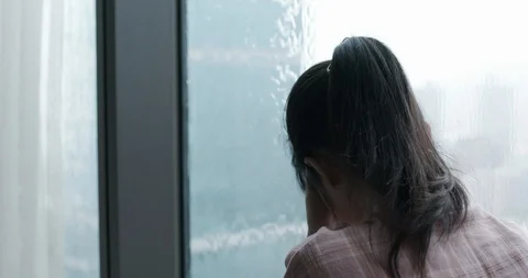 woman cry near by window | Stock Video | Pond5