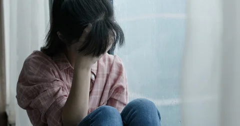 woman cry near by window | Stock Video | Pond5