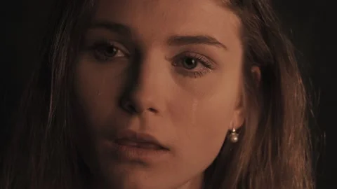 Woman is crying in the dark | Stock Video | Pond5