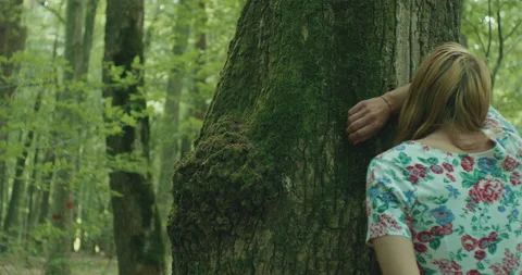 Woman Crying on a Tree | Stock Video | Pond5