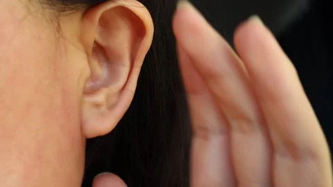 A Woman Cups Her Ear To Hear Better - Cl... | Stock Video | Pond5