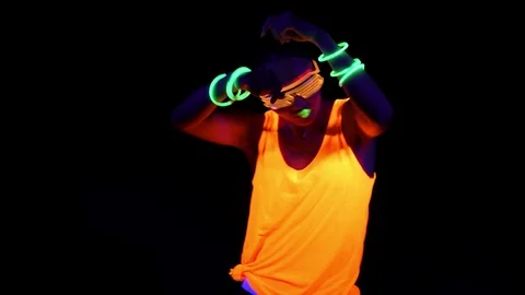 Woman dancing in UV blacklight, glow par... | Stock Video | Pond5