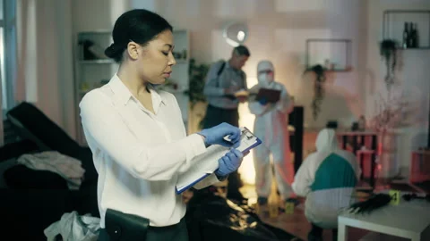 Woman detective documenting evidence at ... | Stock Video | Pond5