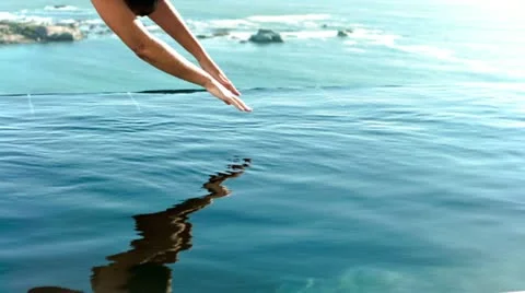 Woman diving into the water in slow moti... | Stock Video | Pond5
