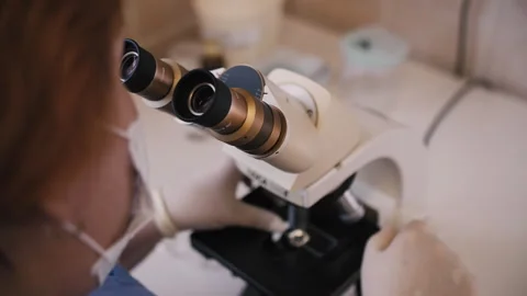 Woman Doctor Watching Microscope. Labora... | Stock Video | Pond5