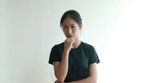 Woman doing boring poses on colored back... | Stock Video | Pond5