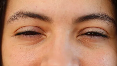 Woman doing cross eye. Close-up person c... | Stock Video | Pond5