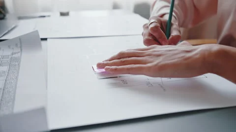 Woman draws interior design on paper usi... | Stock Video | Pond5