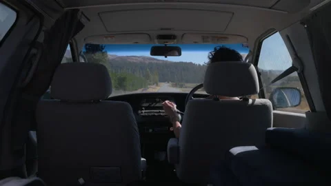 A woman drives her van during a roadtrip... | Stock Video | Pond5