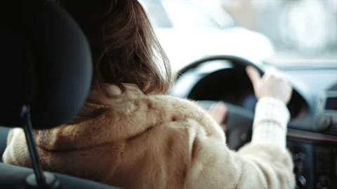 Woman driving a car in slow motion, hand... | Stock Video | Pond5